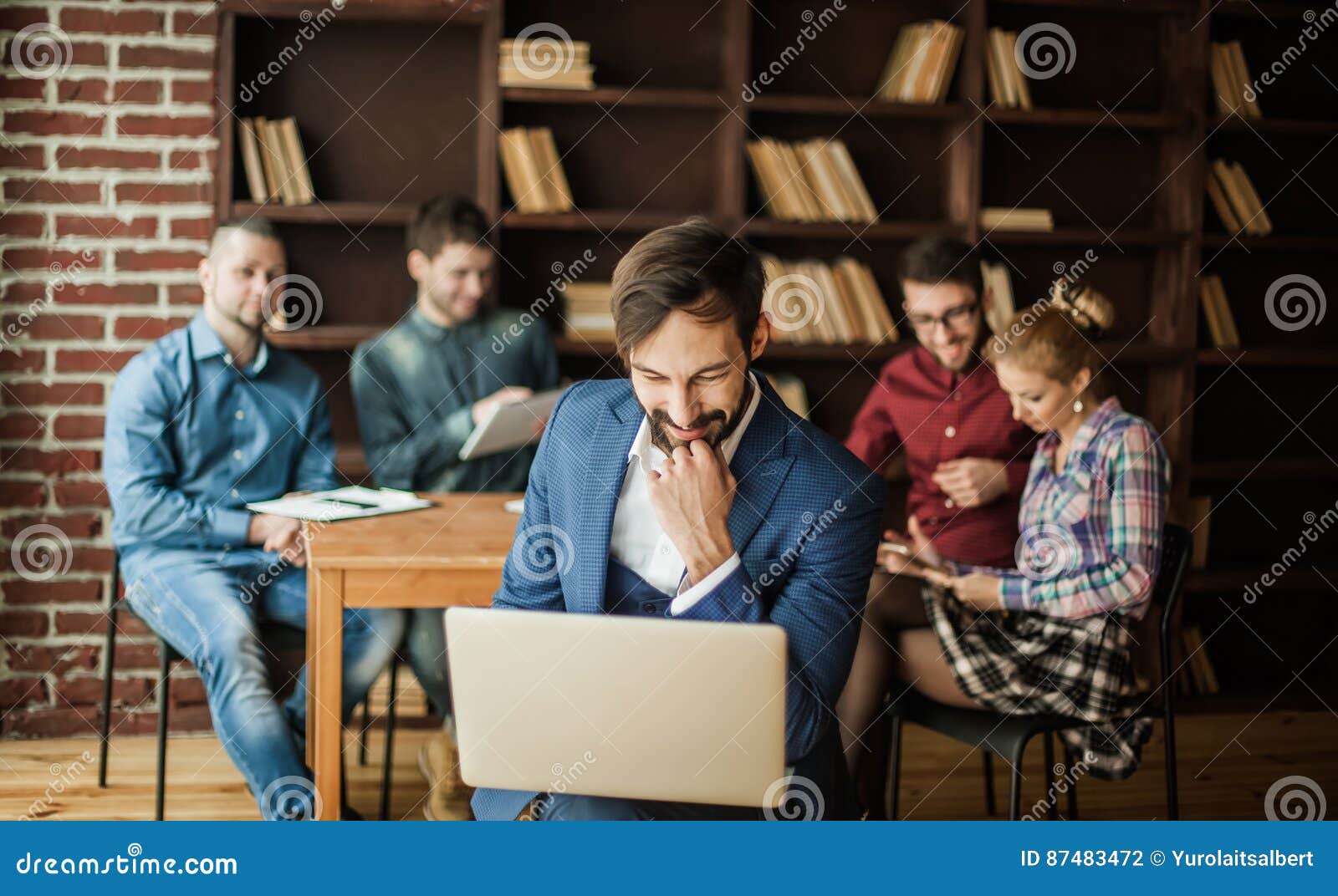 Sales Manager with Laptop on the Background of Business Team in Stock ...