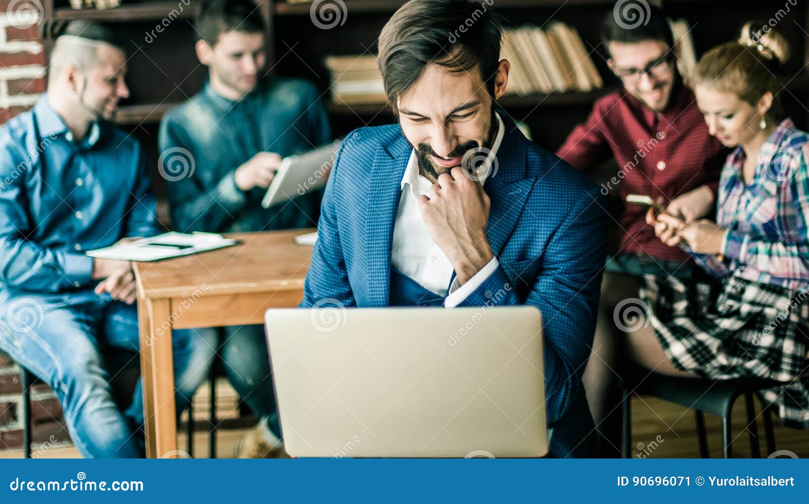 Sales Manager with Laptop on the Background of Business Team in Stock ...