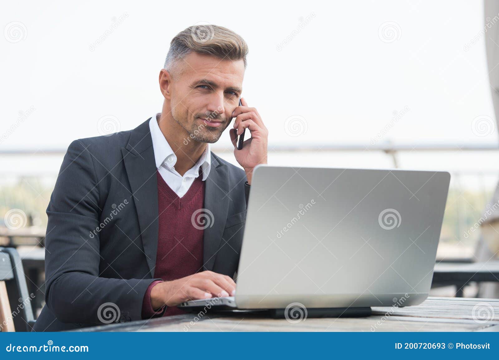 Sales Manager Talk To Client on Mobile Phone Using Computer Technology ...
