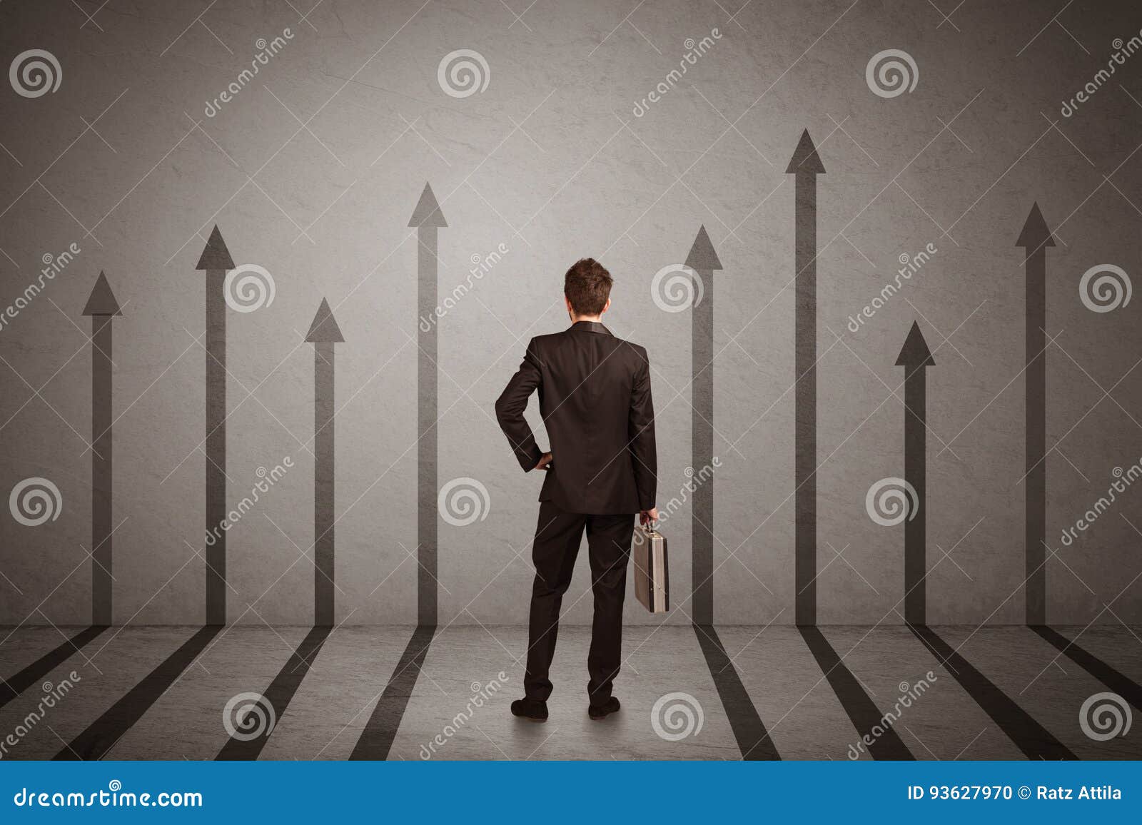Sales Person Looking at Arrows Pointing Up on the Wall Concept Stock ...