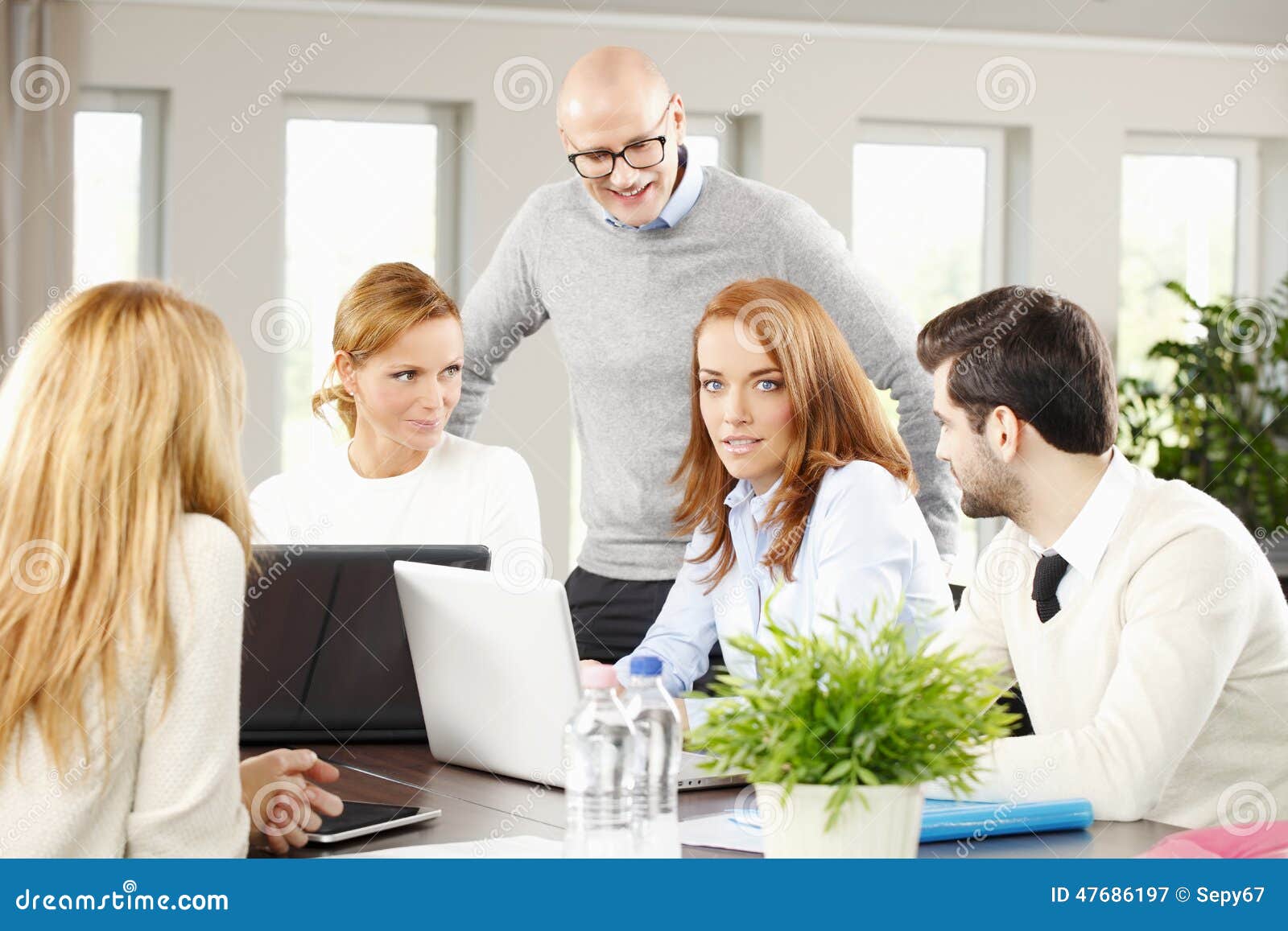 Sales team with computer stock image. Image of files - 47686197