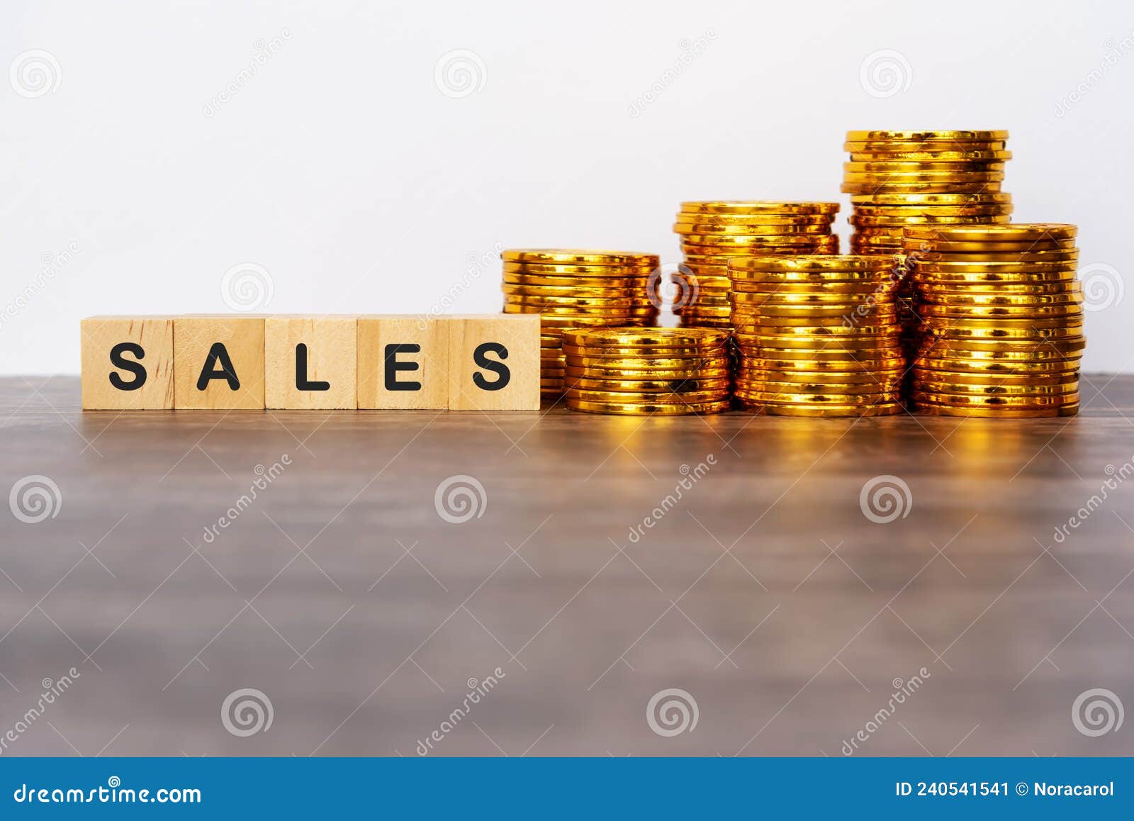 Sales Text On Wood Block On Top Of Stack Of Coins Royalty-Free Stock ...