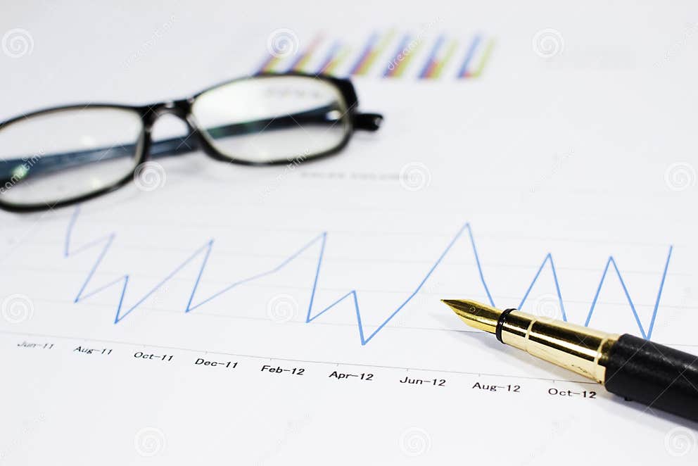 Sales Volume Charts on the Table with Pen Stock Photo - Image of prices ...