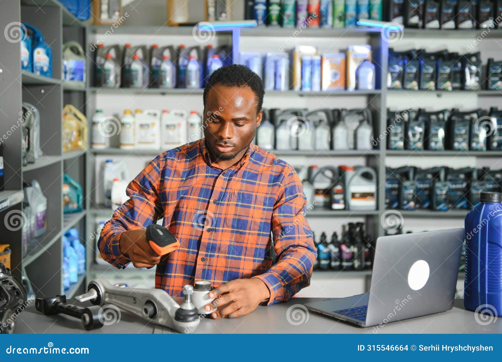 A Salesman in an Auto Parts Store Stock Photo - Image of sale ...