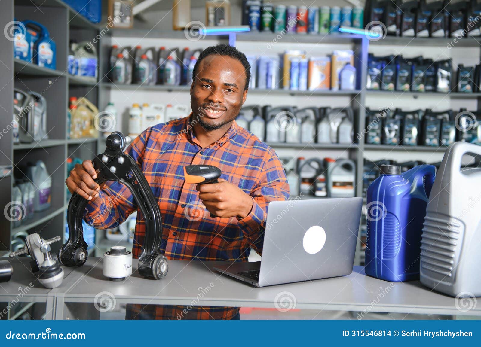 A Salesman in an Auto Parts Store Stock Photo - Image of automobile ...