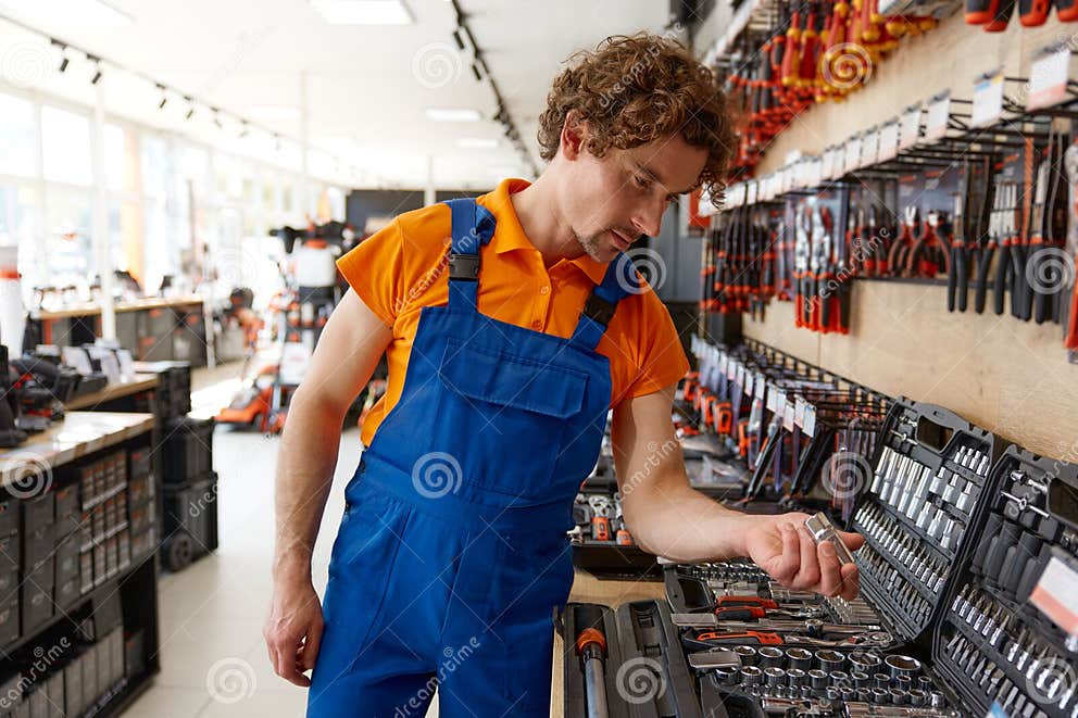 Salesman Checking Socket Wrenches in Tool Box at Hardware Store Stock ...