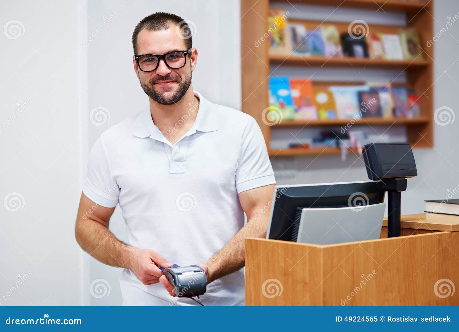 Salesman at the Checkout in a Bookstore Stock Image - Image of paying ...