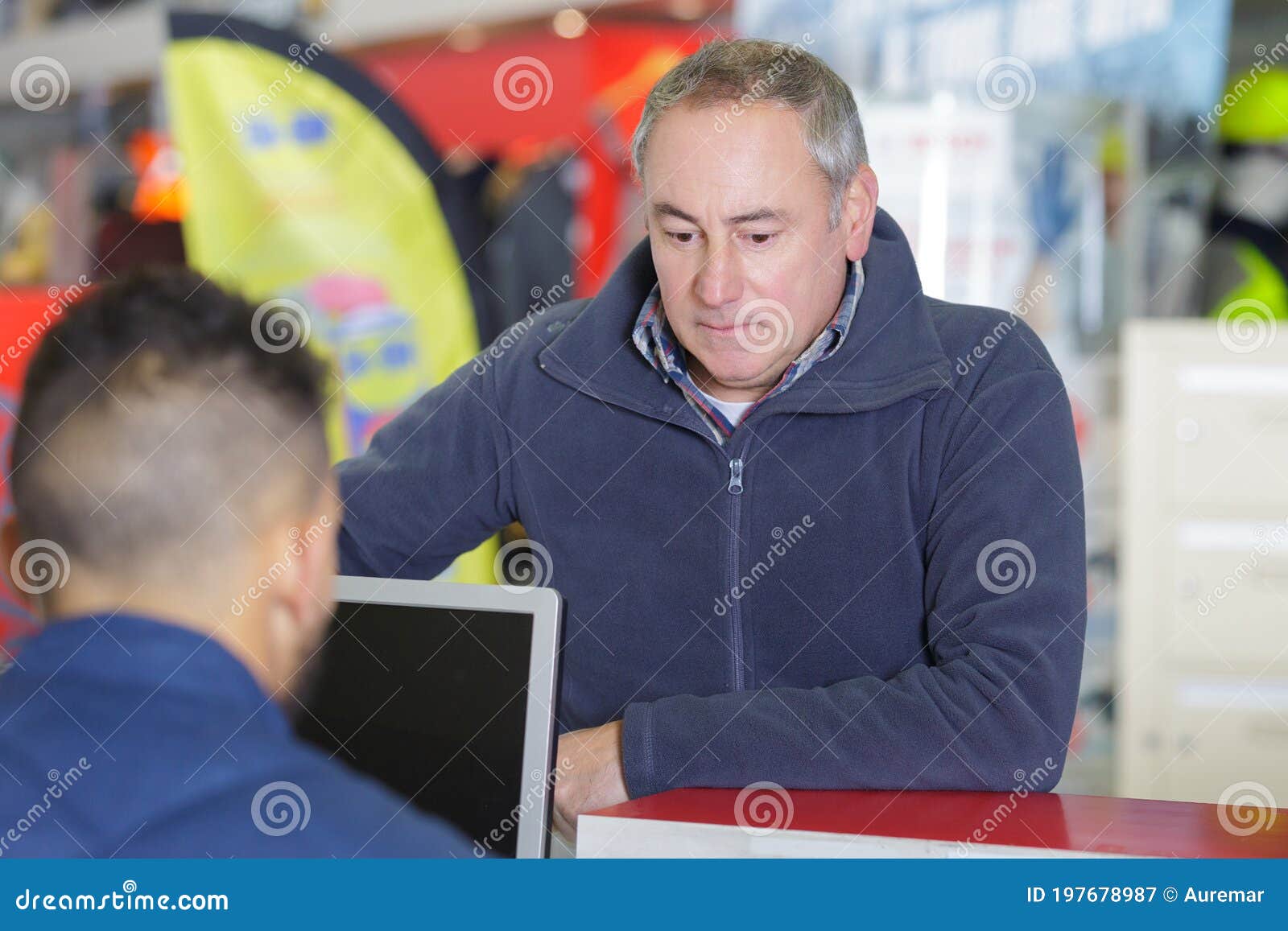 Salesman and Client at Cash Counter in Hardware Store Stock Image ...