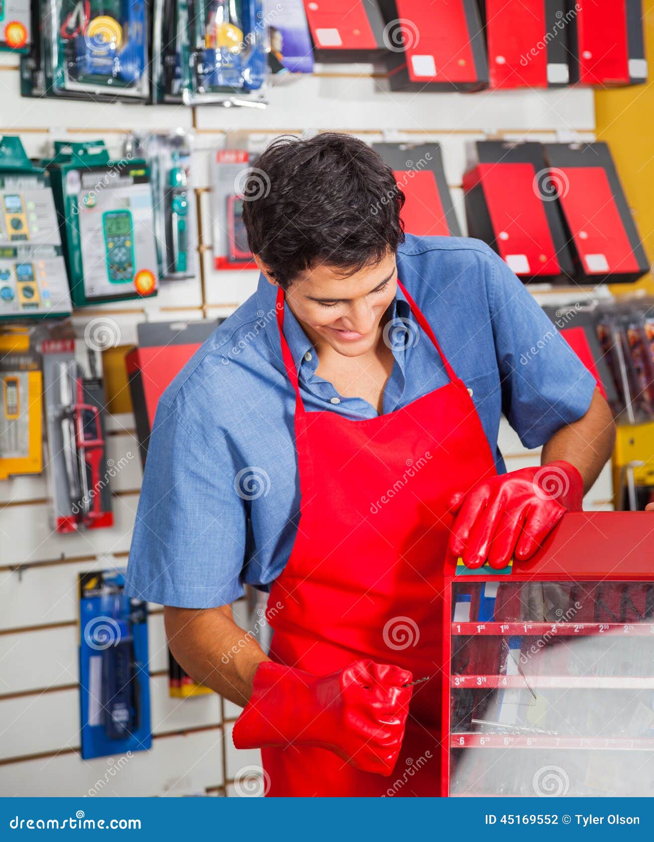 Salesman with Drill Bit and Toolbox in Store Stock Photo - Image of ...