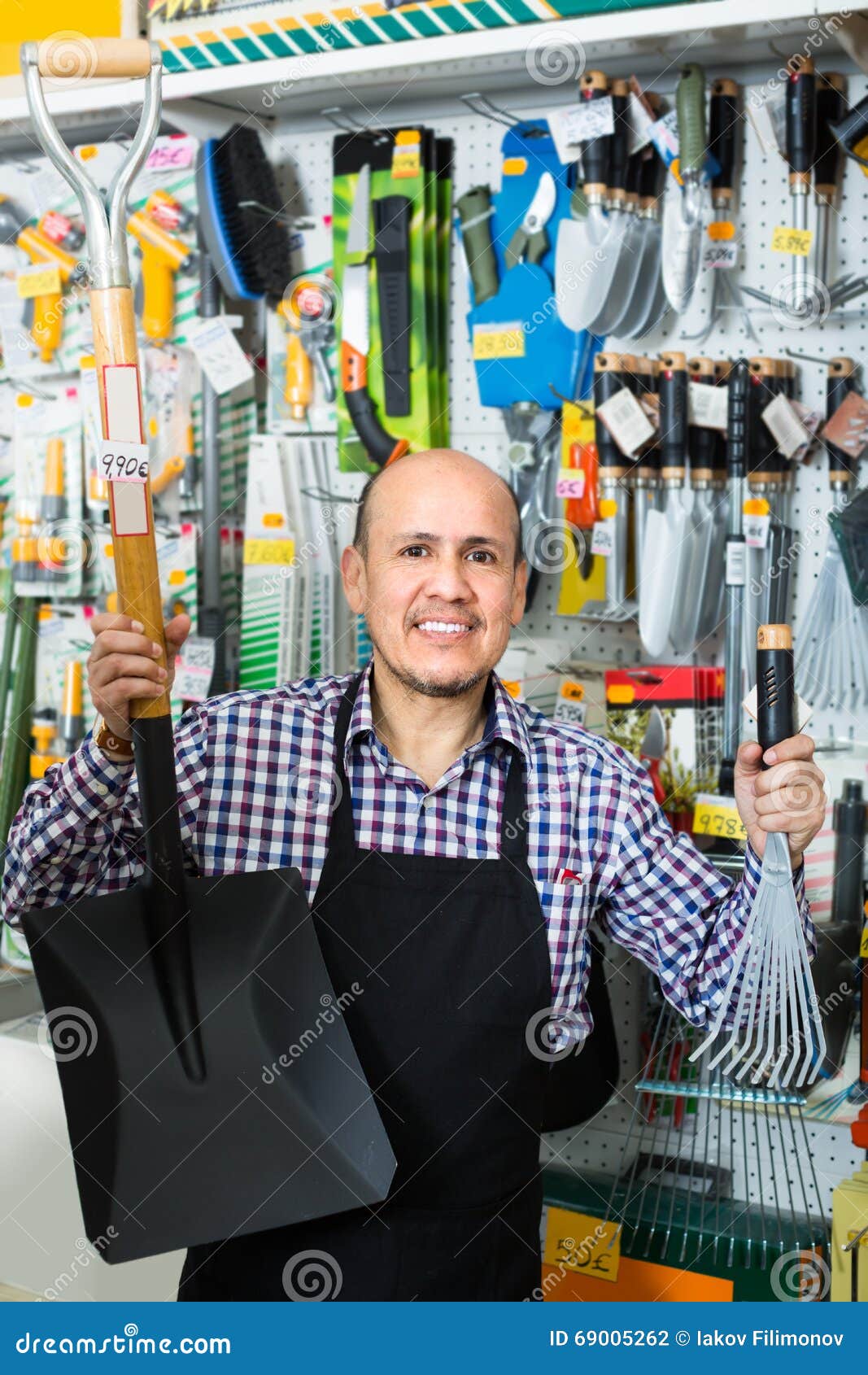 Salesman with Garden Tools in Store Stock Photo - Image of consultation ...