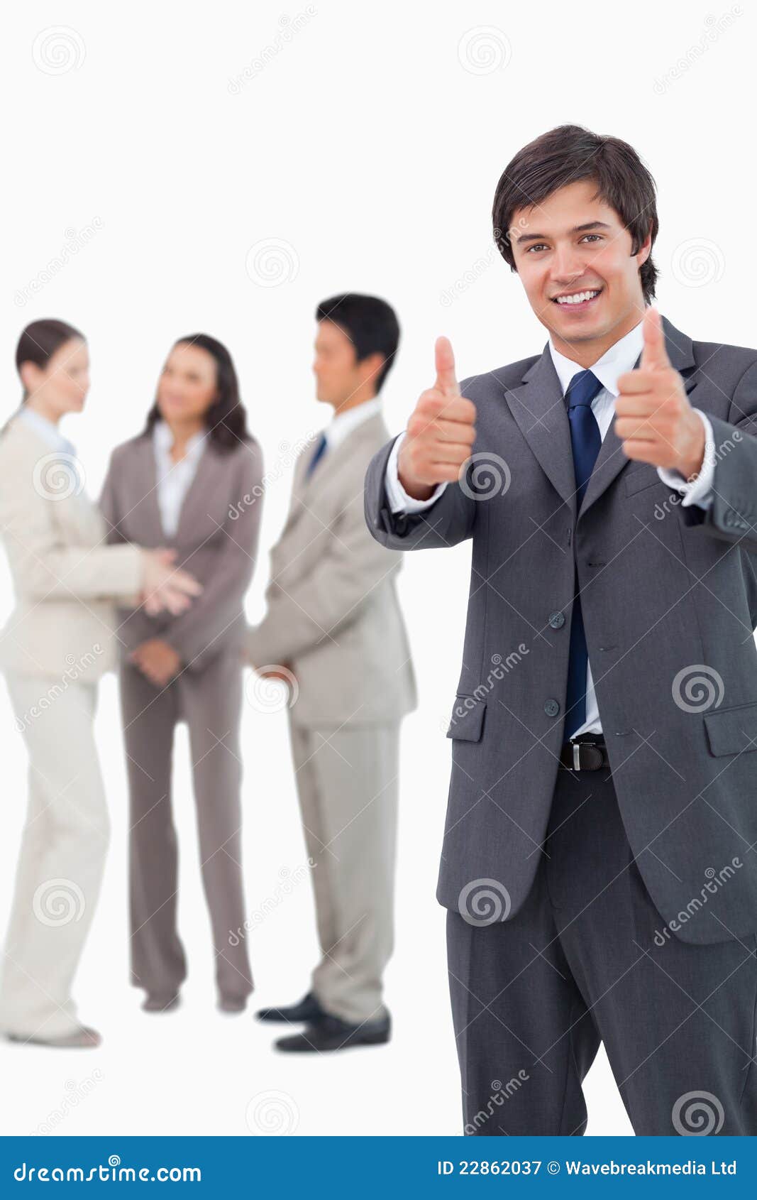 Salesman Giving Thumbs Up with Team Behind Him Stock Image - Image of ...