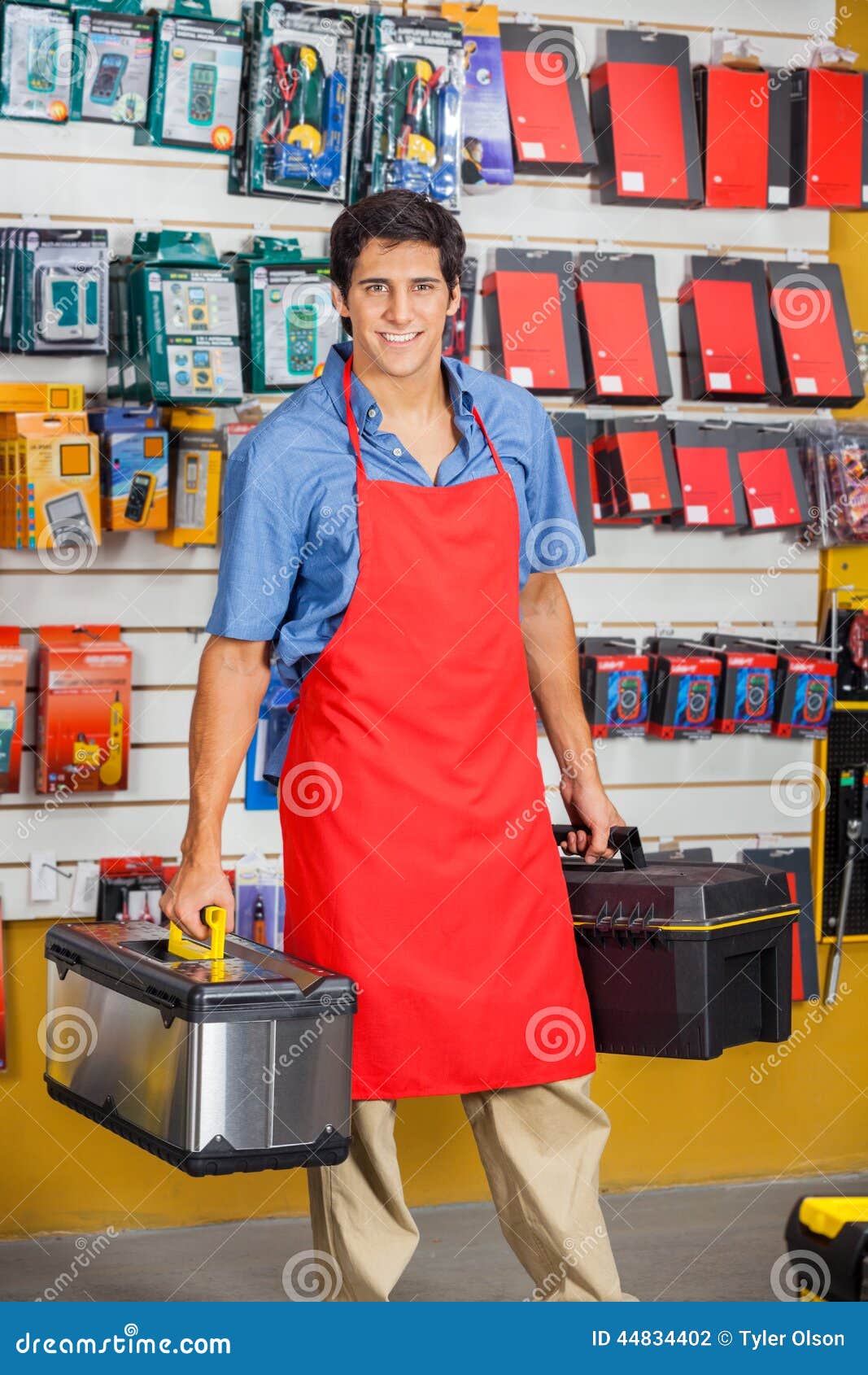 Salesman Holding Toolboxes in Hardware Shop Stock Photo - Image of ...