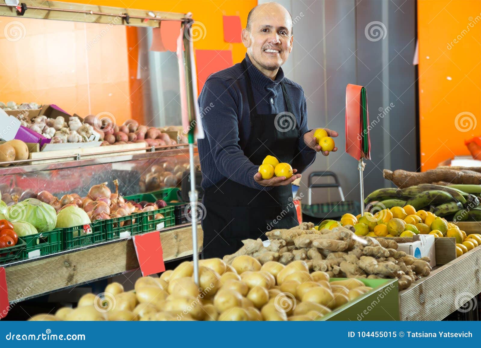 Salesman with Lemon in Vegetable Shop Stock Image - Image of occupation ...