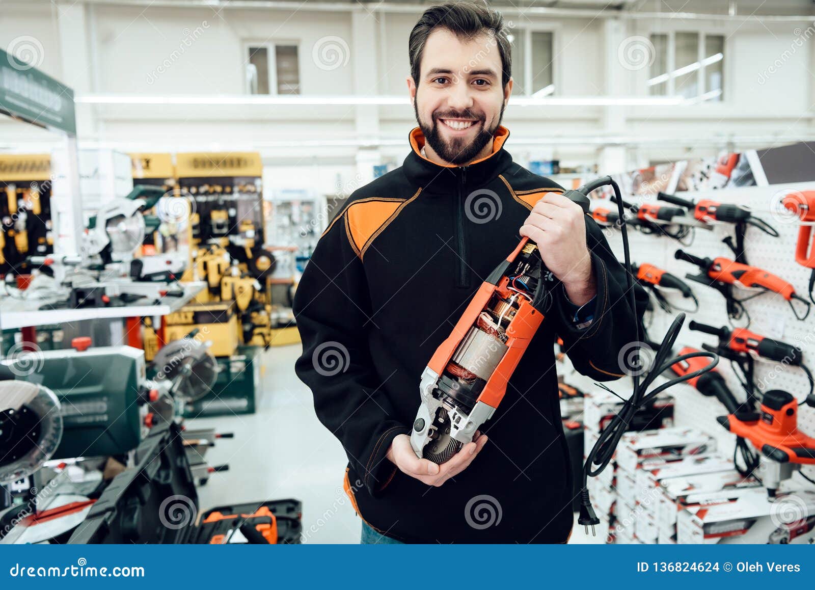 Salesman is Posing with New Disc Grinder in Power Tools Store. Stock ...