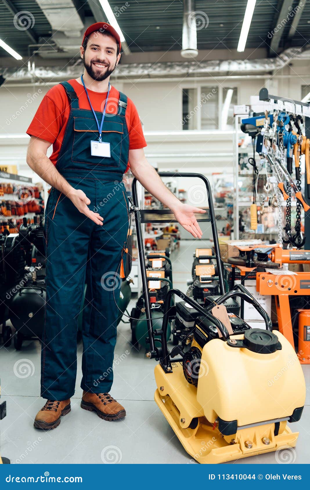 Salesman is Posing with Plate Compactor on Foreground in Power Tools ...