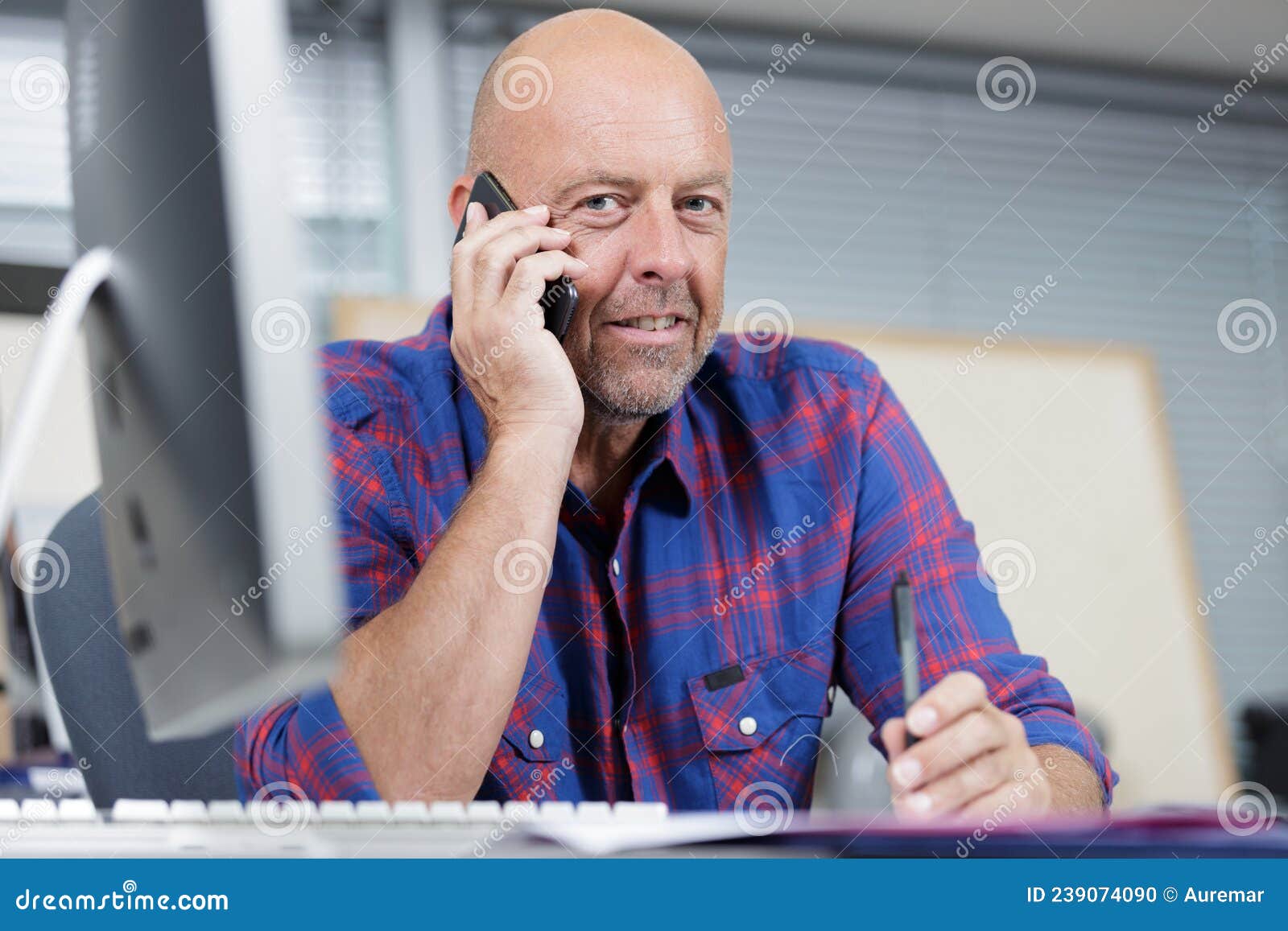 Salesman Sat at Computer Desk Talking on Smartphone Stock Photo - Image ...