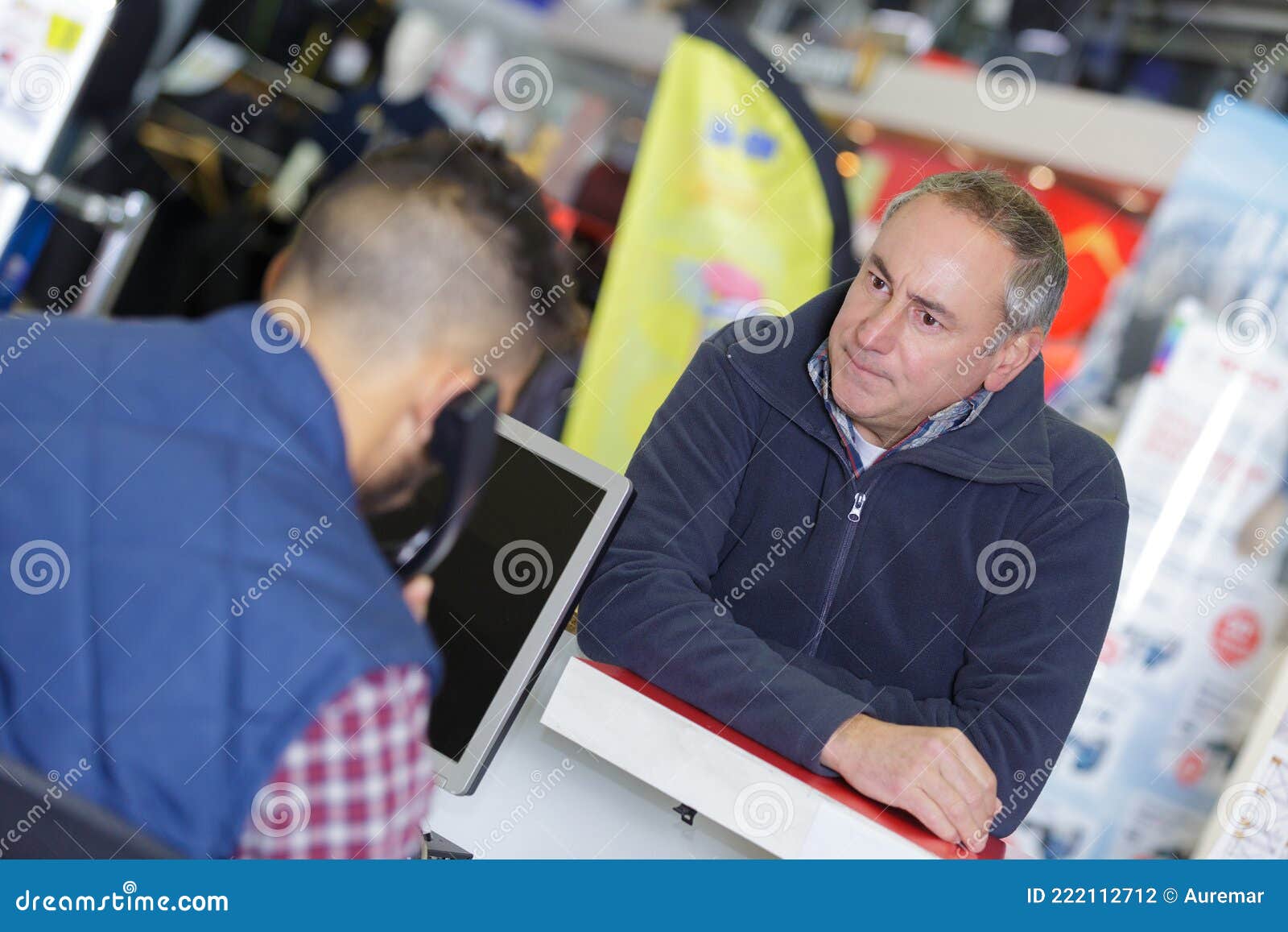 Salesman Serving Customer in Boutique Stock Photo - Image of talk ...
