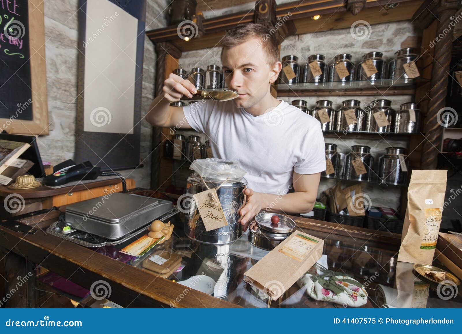 Salesman Smelling Tea in Store Stock Image - Image of estonia, person ...