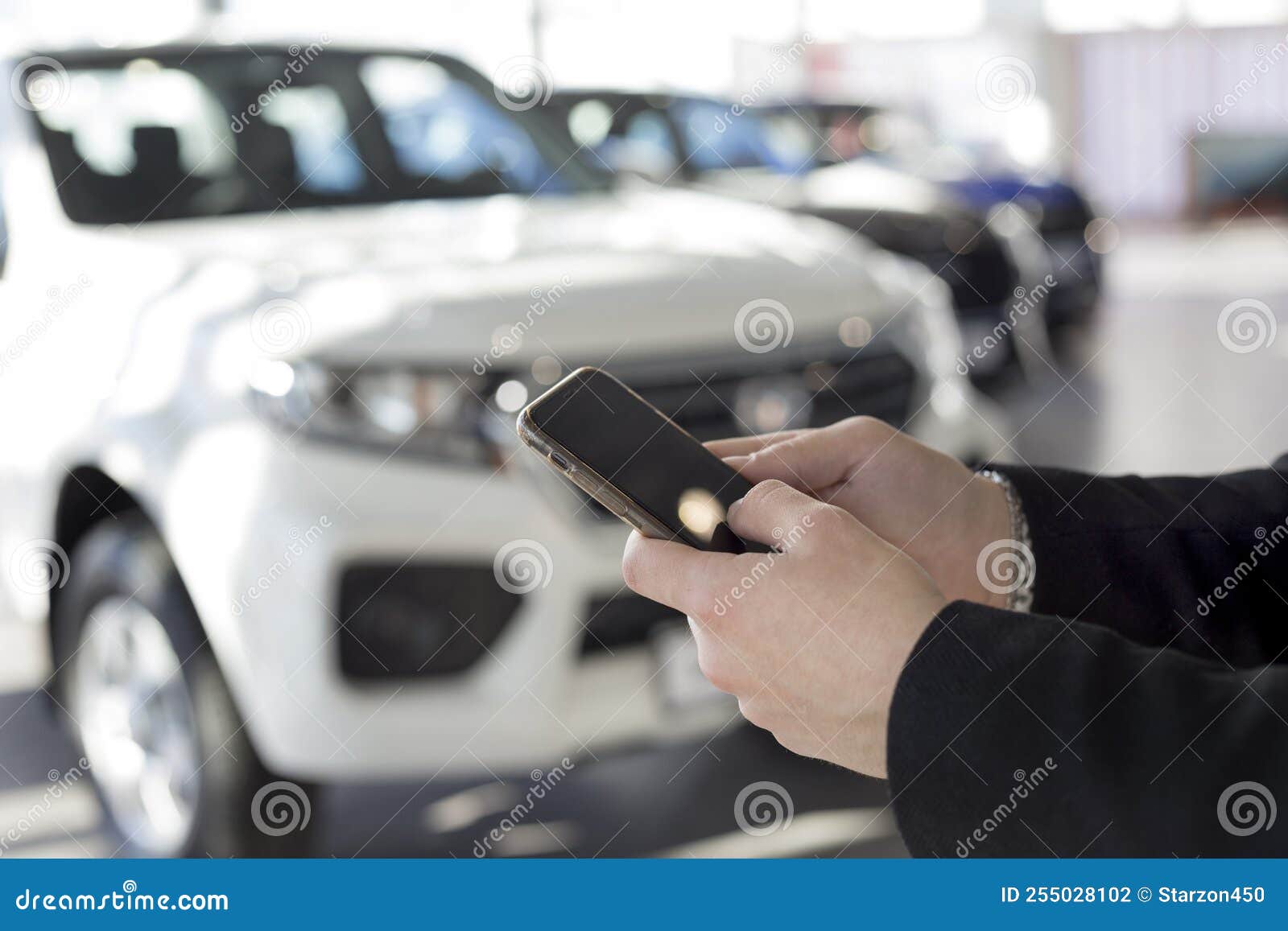 Salesman Using Mobile Smart Phone at Dealer Showroom. Modern Working ...