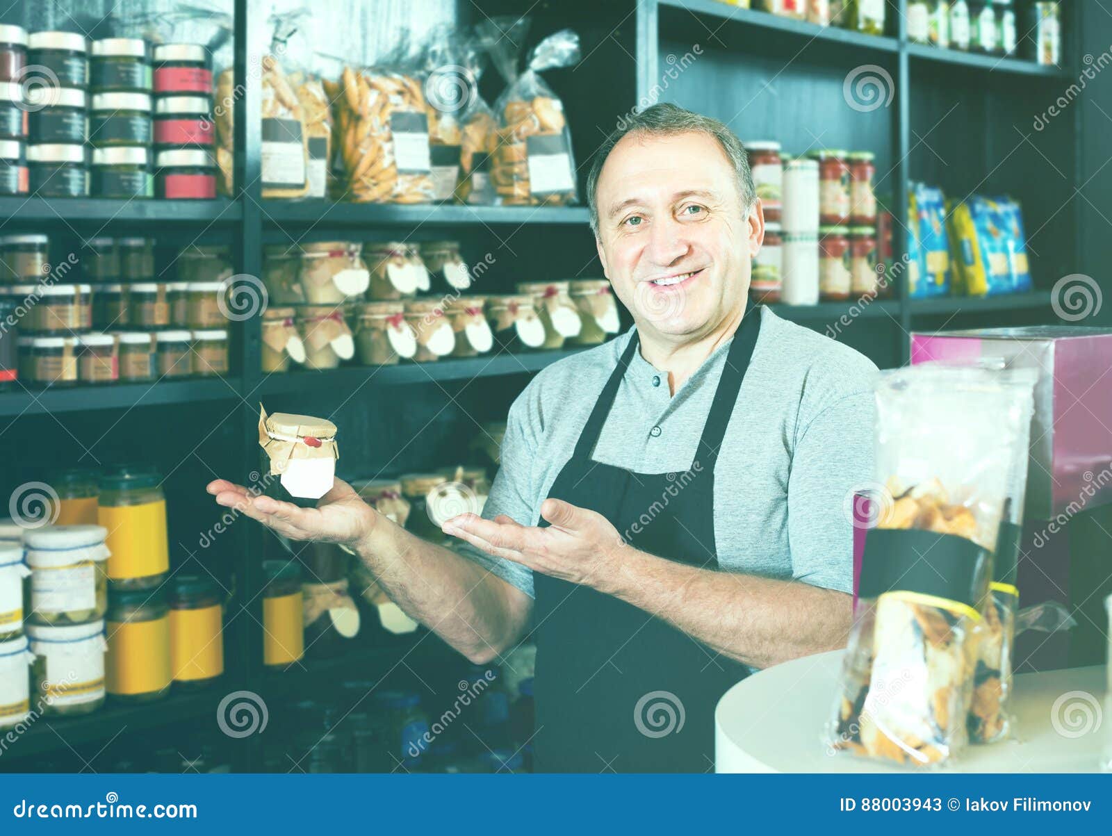 Salesman Working in Delicatessen Section of Ordinary Grocery Stock ...
