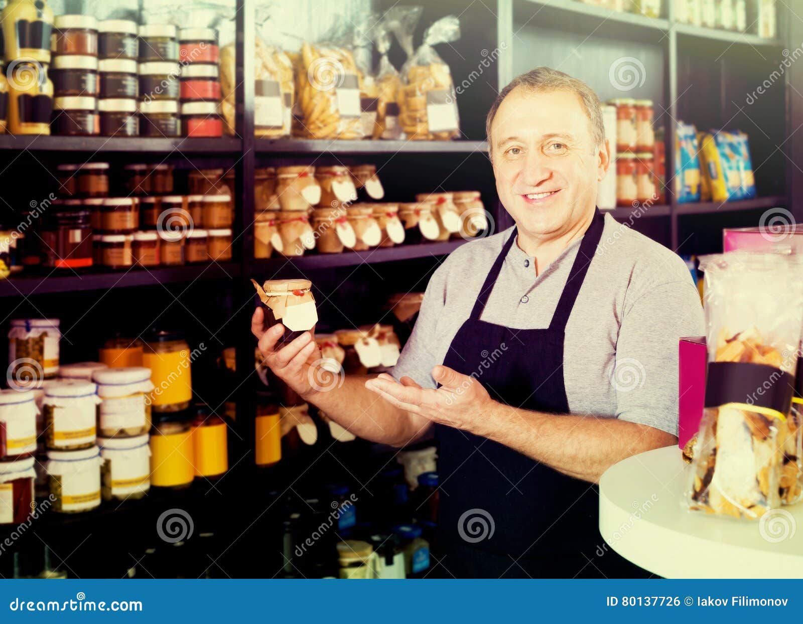 Salesman Working in Delicatessen Section of Ordinary Grocery Stock ...