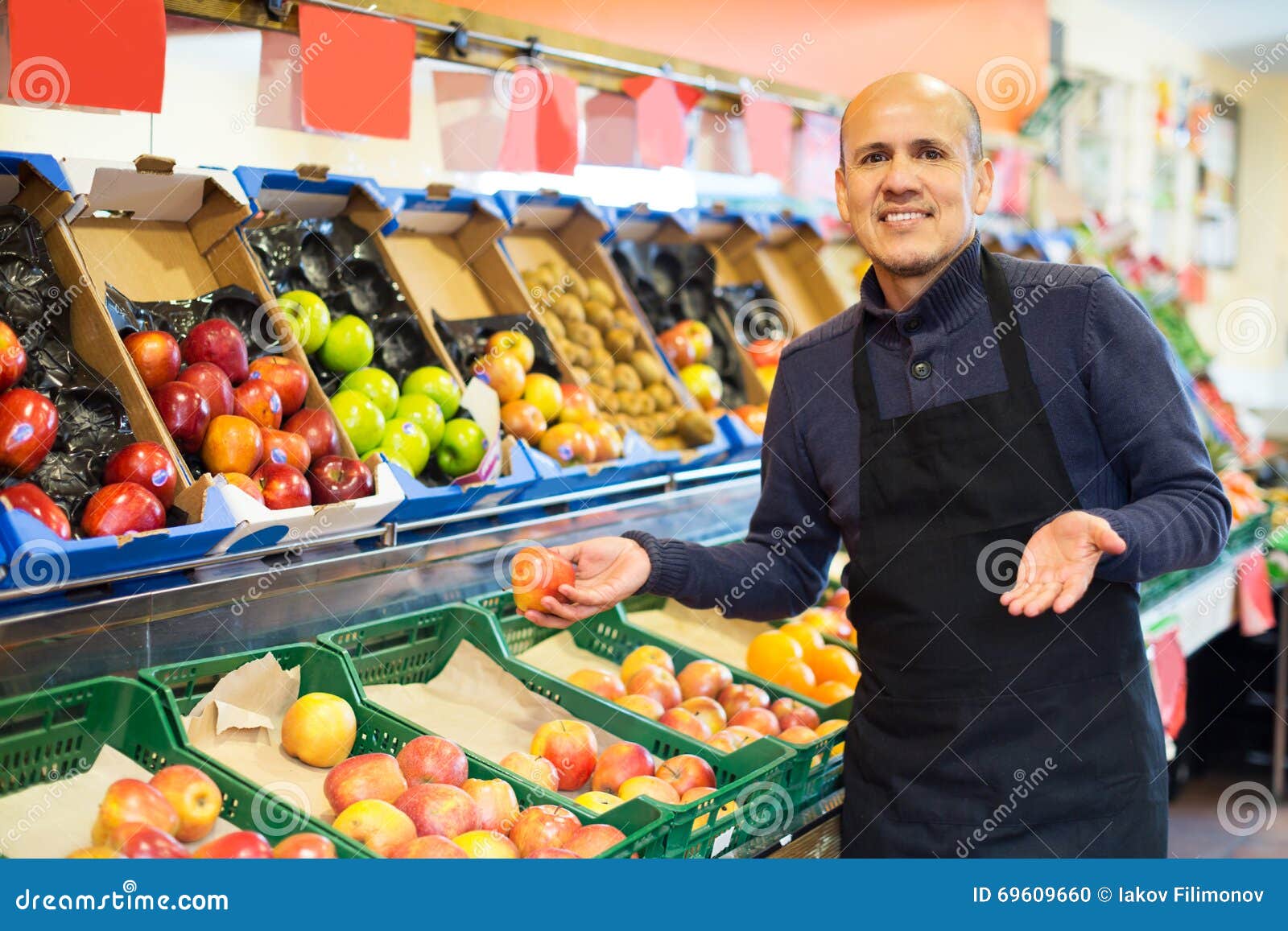 Salesman Working in Fruit Section Stock Photo - Image of retail, offer ...