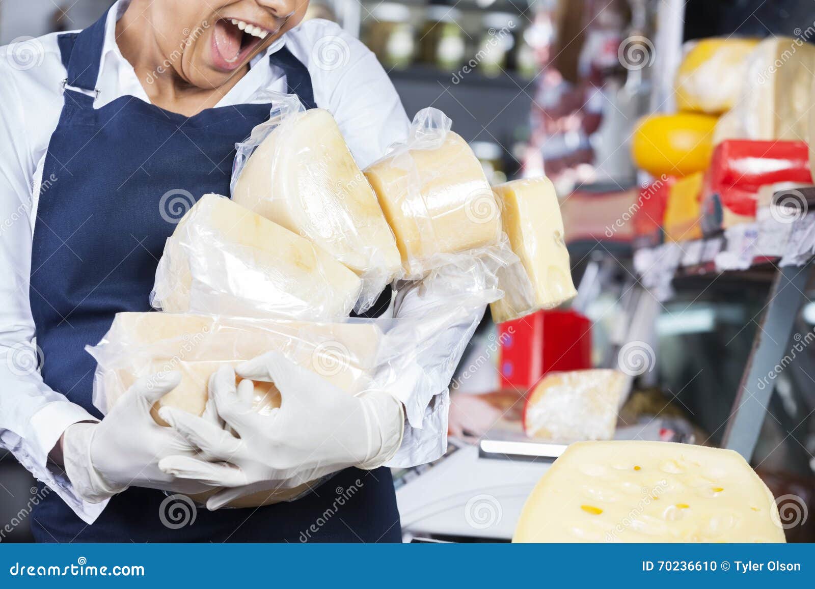 Saleswoman Dropping Stack of Cheese in Shop Stock Photo - Image of ...