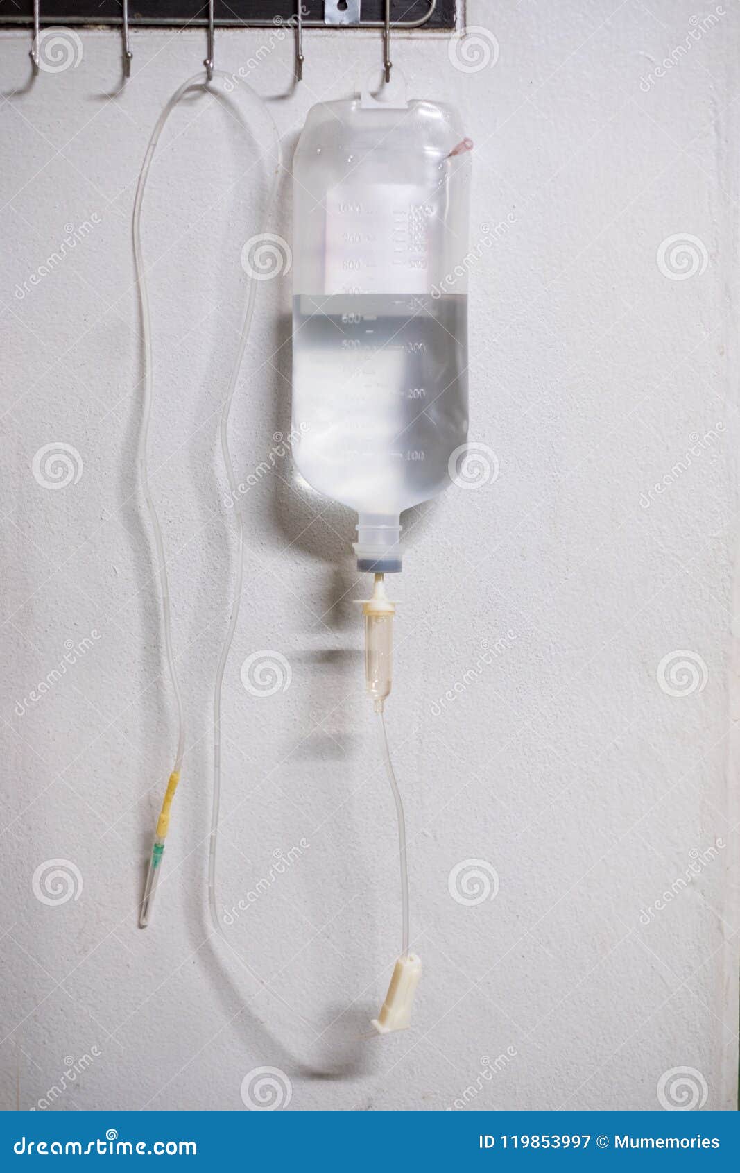 Saline Solution Iv Bag with Syringe Line Hanging on Wall Stock Image ...
