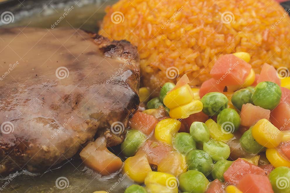 Salisbury Steak, Served with Mixed Vegetables and Fried Java Rice on a ...