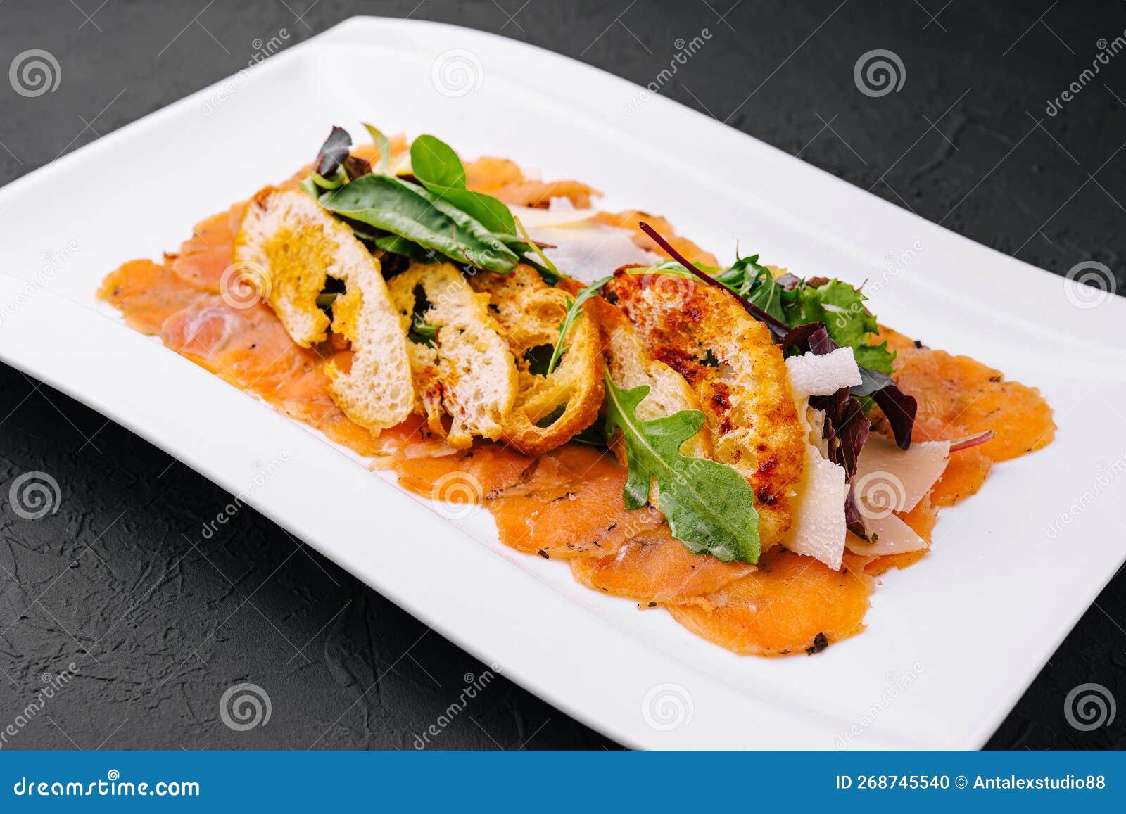 Salmon Carpaccio Served with Toast on Plate Stock Photo - Image of ...