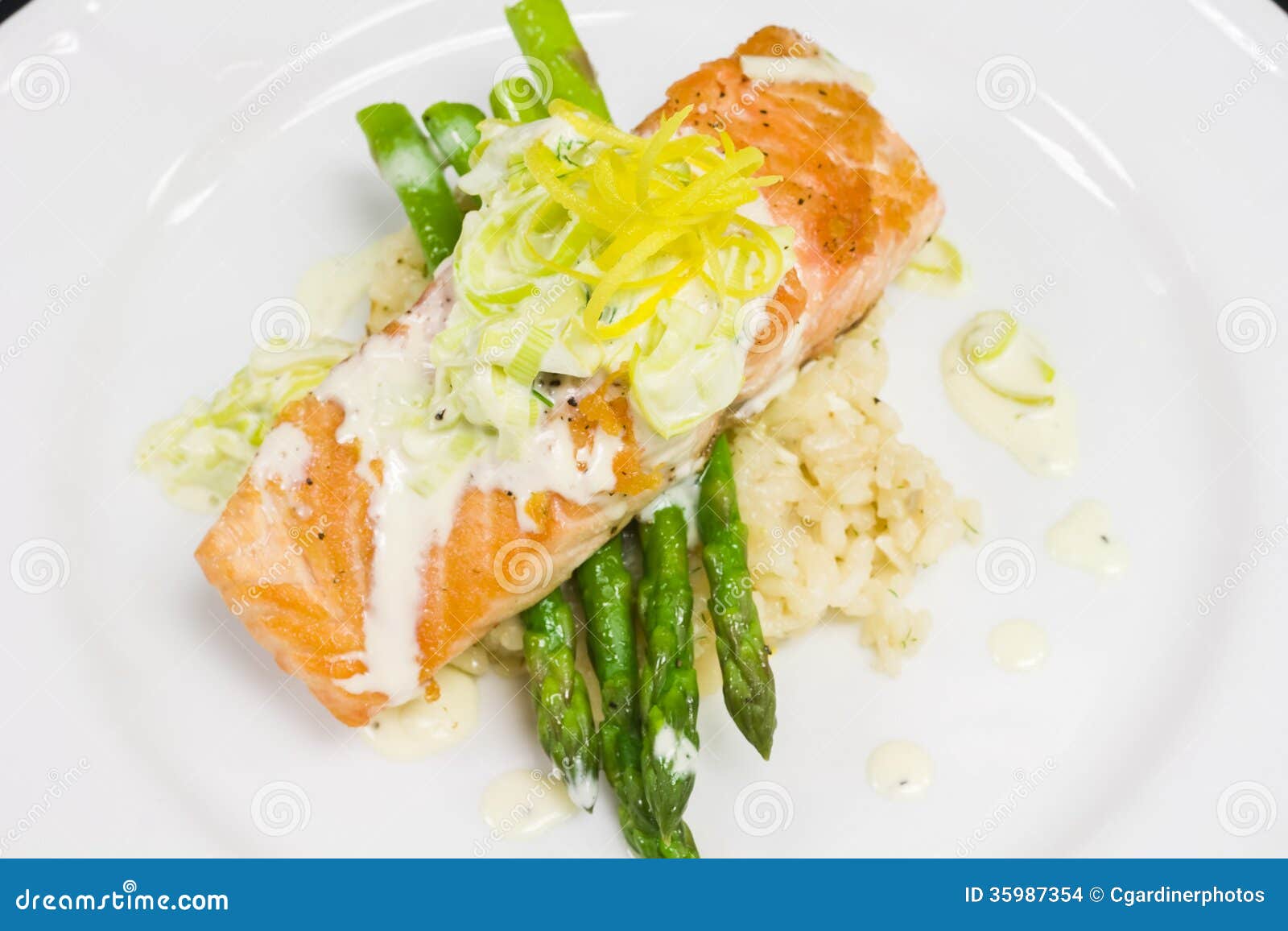 Salmon Entree with Asparagus Stock Photo - Image of cream, garnish ...