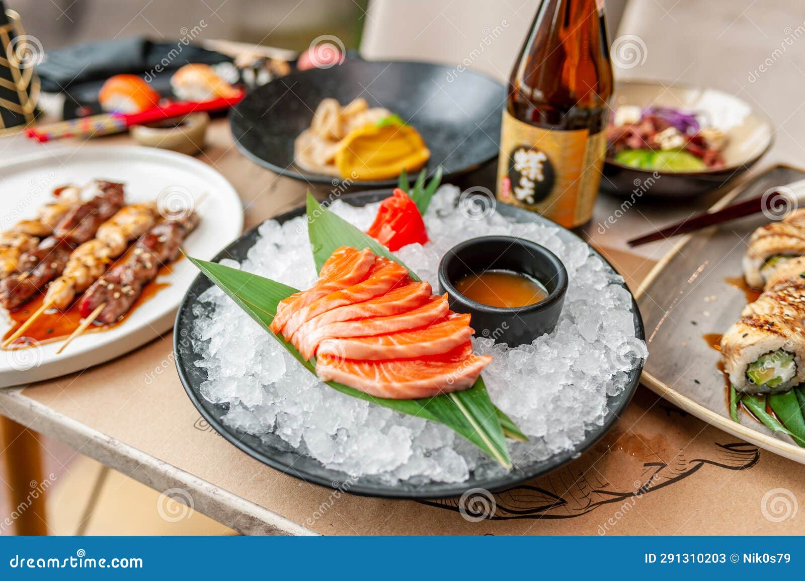 Salmon Sashimi Plate with Sauce and Ice on a Table Stock Image - Image ...