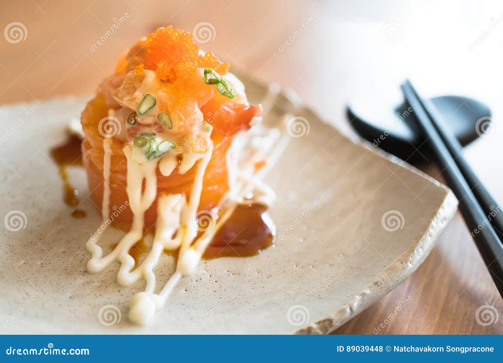 Salmon Sashimi Rolls with Cream and Flying Fish Roe Stock Photo - Image ...