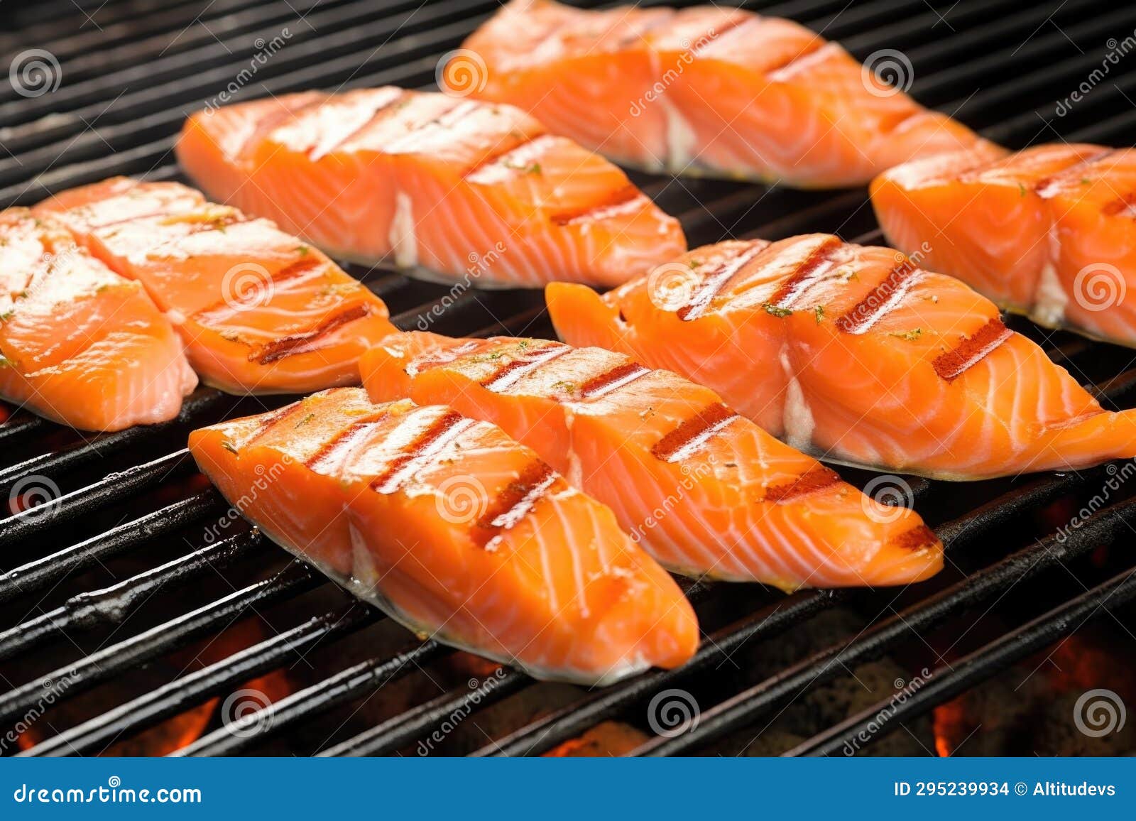 Salmon Slices on Grill, Spread Out Evenly Stock Photo - Image of meal ...