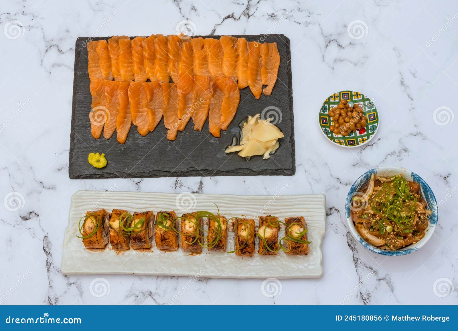 Salmon Sushi Rolls Platted on a White Marble Table Stock Photo - Image ...