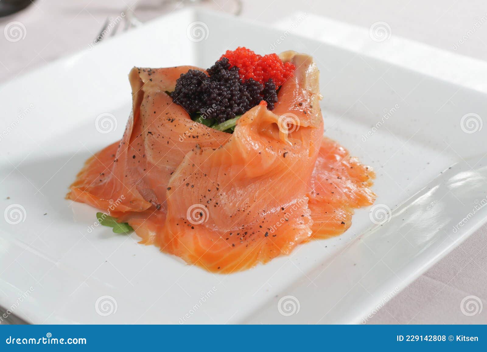 Salmon Volcano Salad with Rocket and Caviar Stock Photo - Image of ...