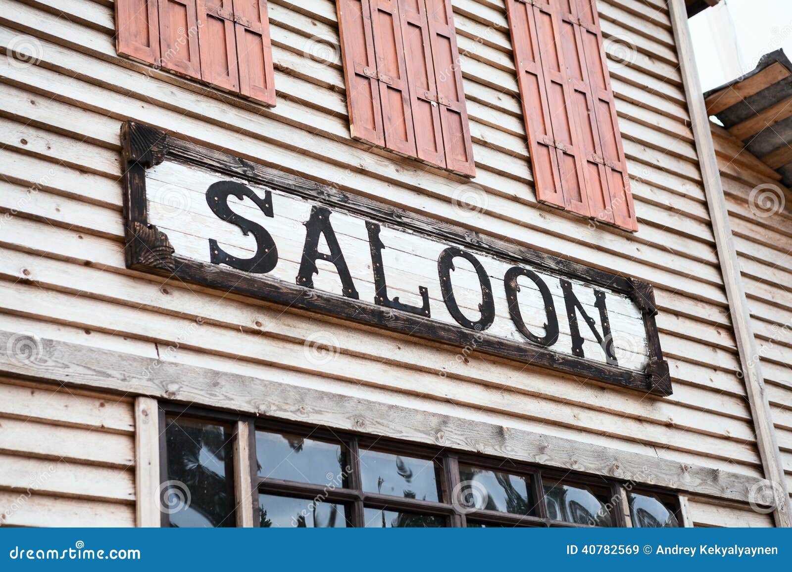 Saloon Sign on Building Facade Stock Image - Image of outlaws, facade ...