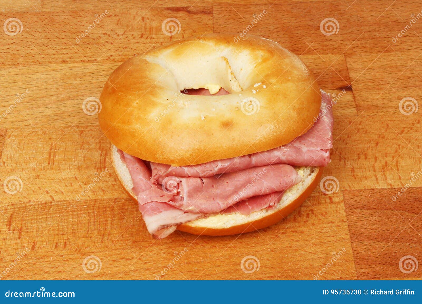 Salt beef bagel on a board stock photo. Image of silverside - 95736730