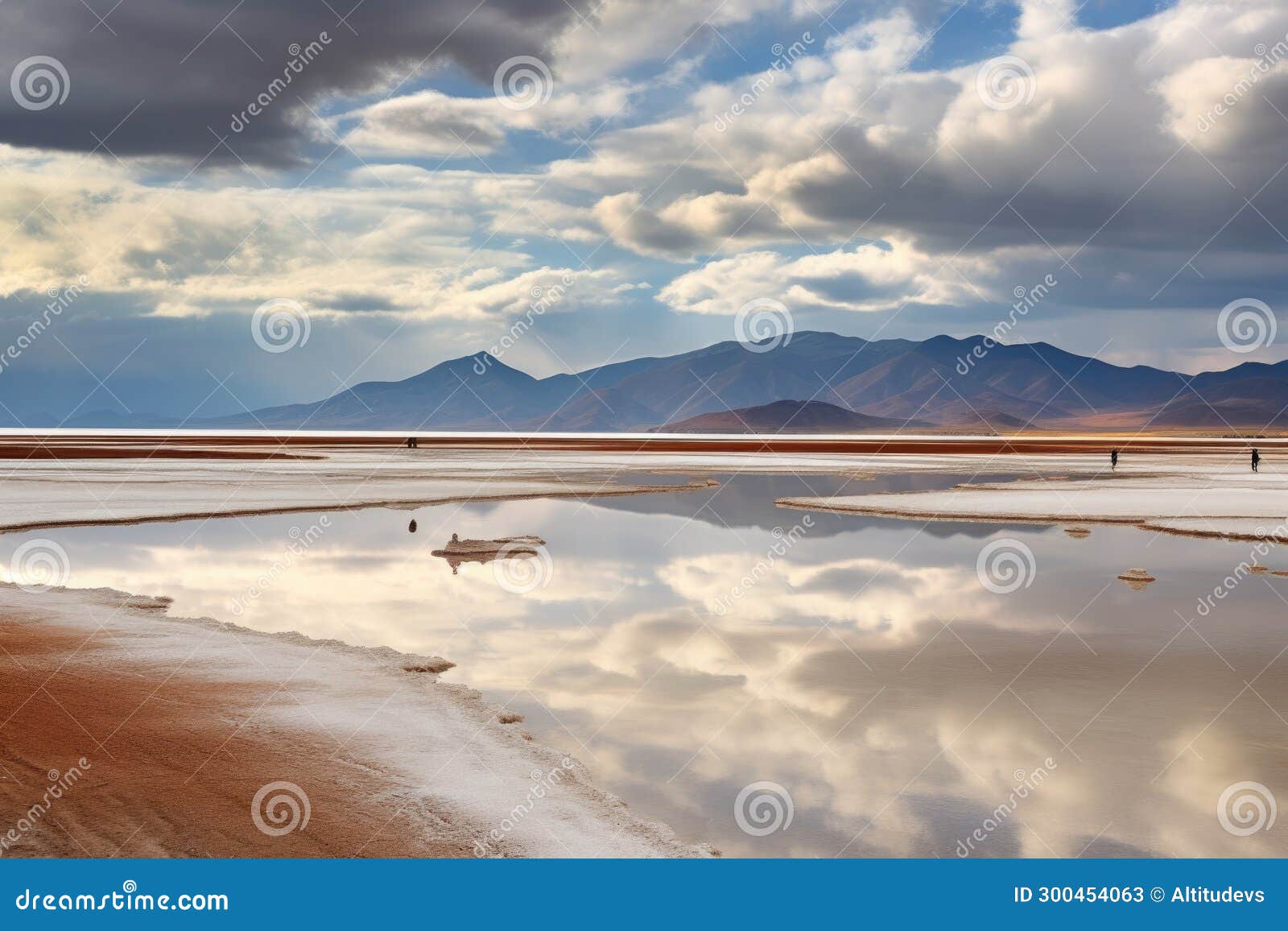 Salt Lagoon with Mountains in the Background Under a Cloudy Sky Stock ...