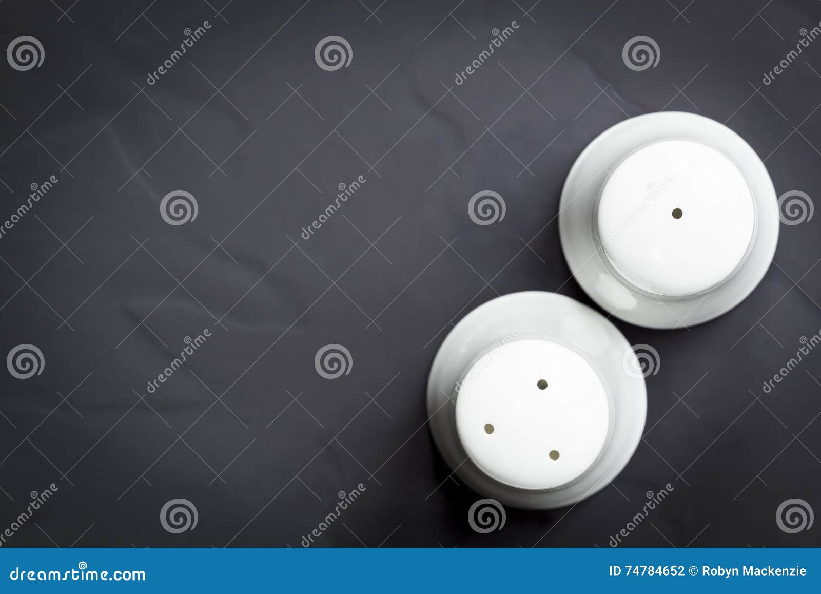 Salt and Pepper Shakers Top View on Slate Stock Photo - Image of salt ...