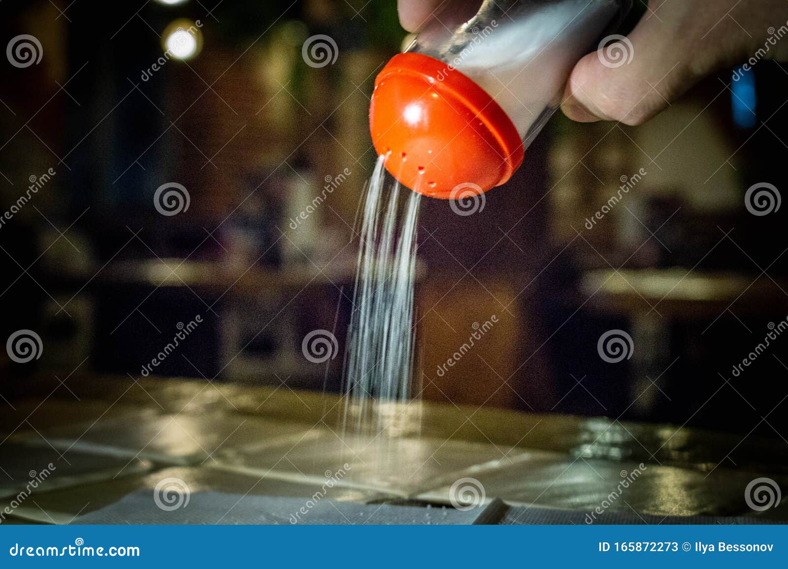 Salt is Poured Down from the Salt Shaker. in the Cafe Stock Image ...