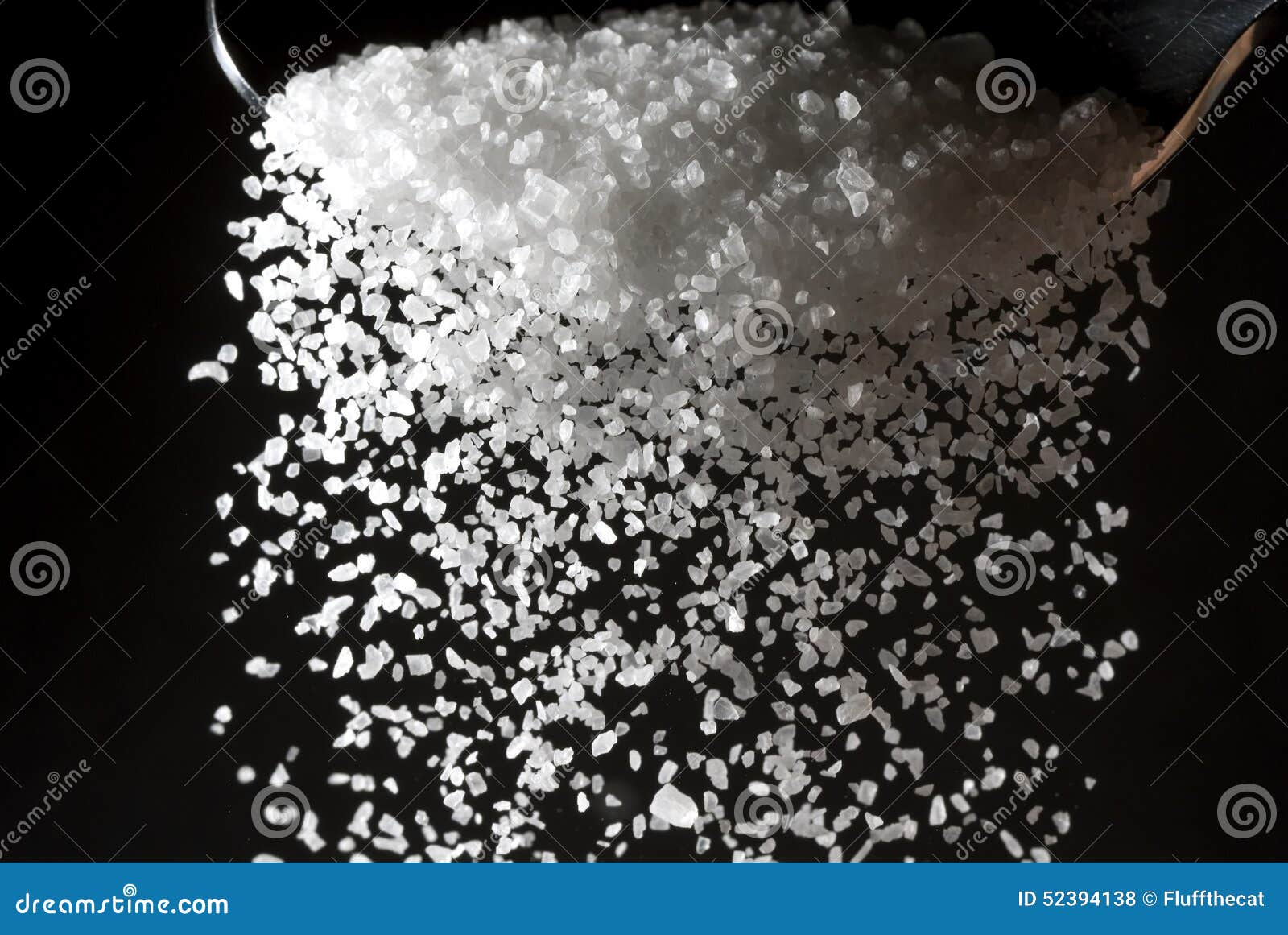Salt pouring from spoon stock photo. Image of mineral - 52394138