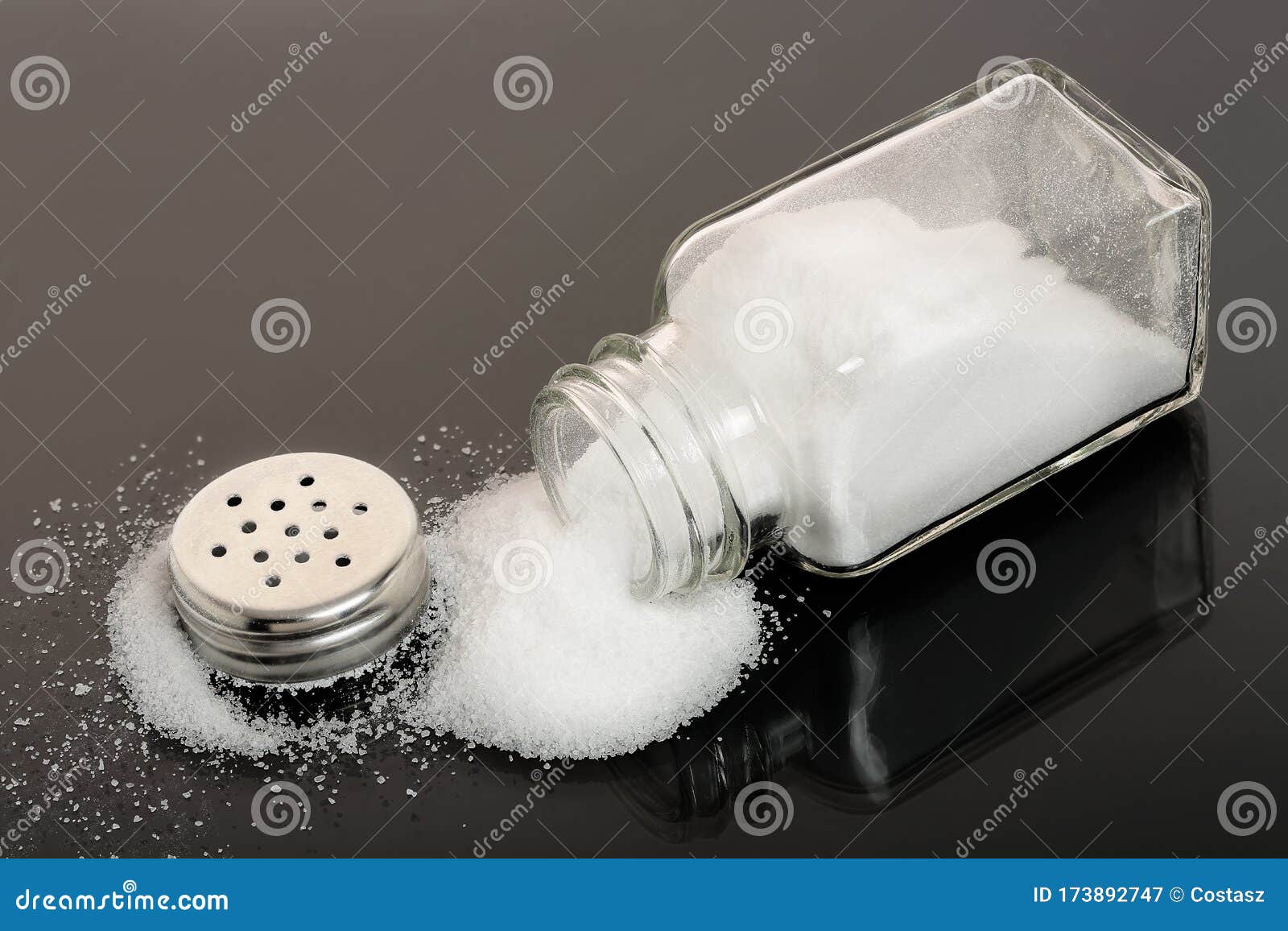 Salt shaker on black stock image. Image of diet, spice - 173892747