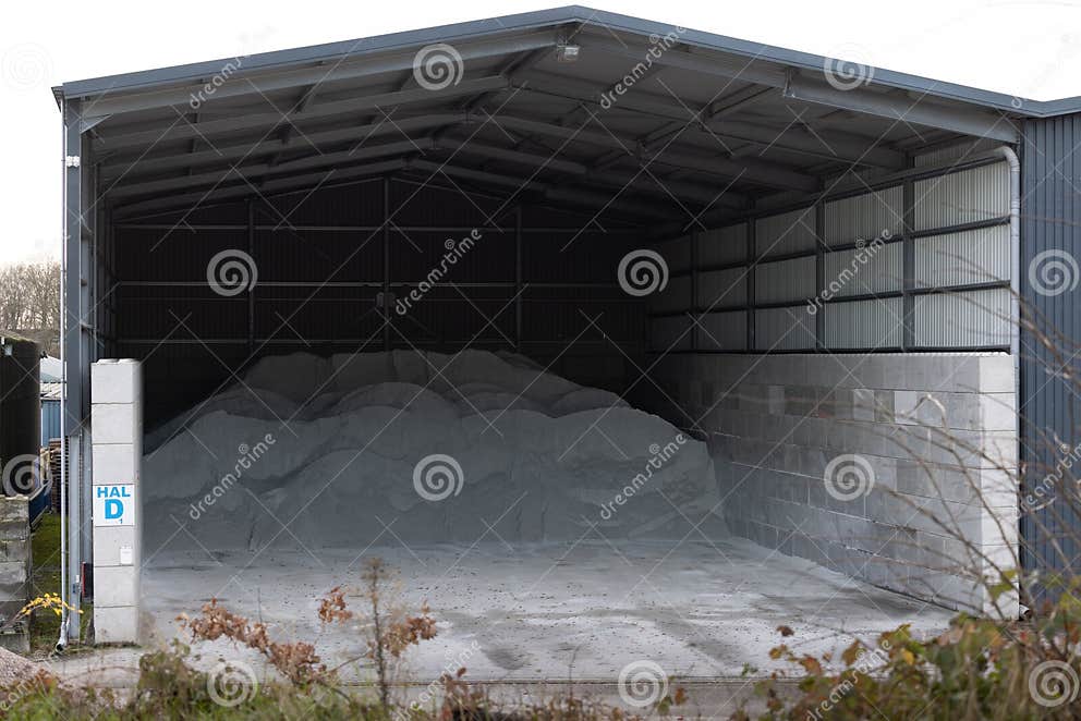Salt Storage Shed with a Large Pile of Salt. Stock Image - Image of ...