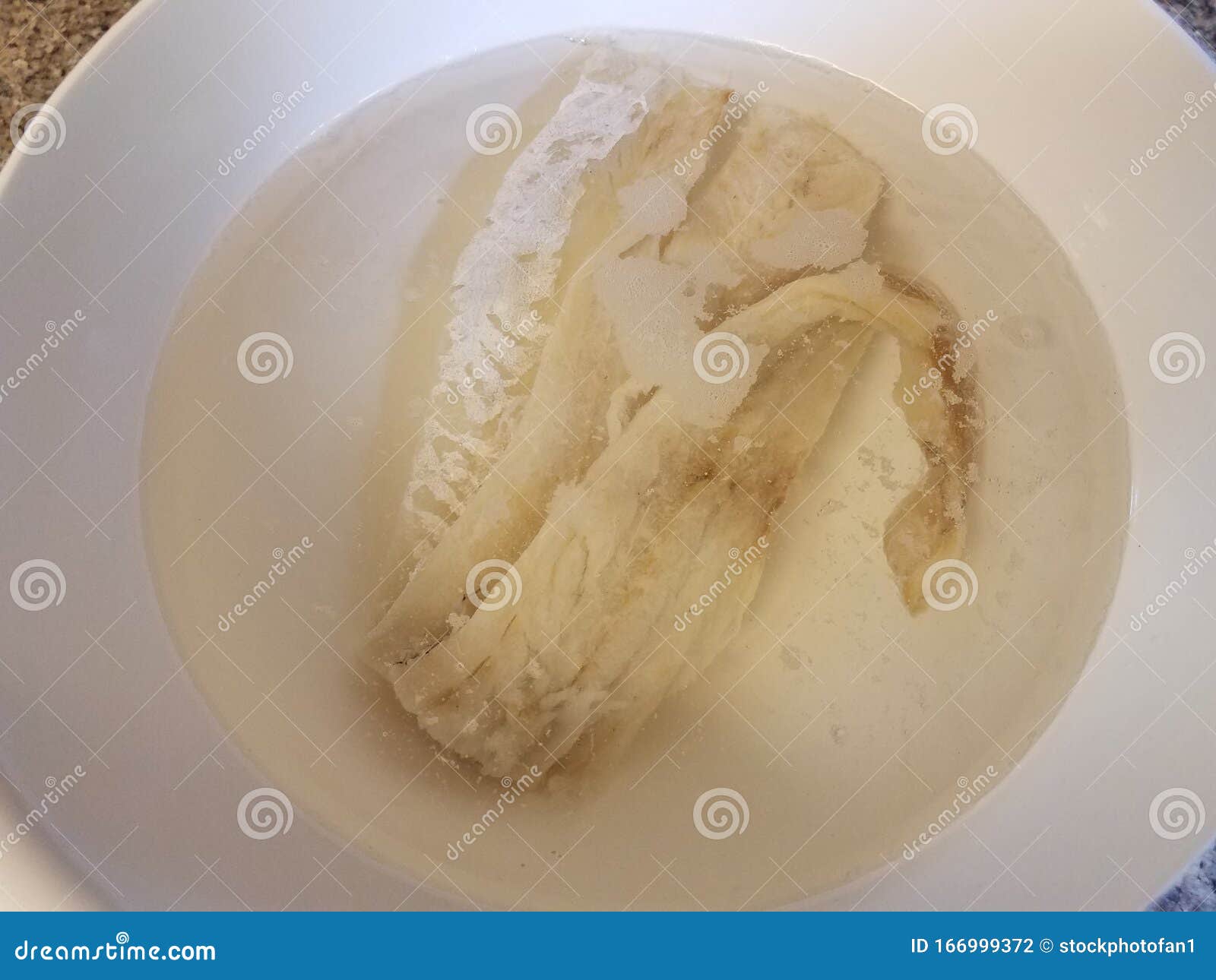 Salted Codfish Fish in White Bowl with Water Stock Photo - Image of ...