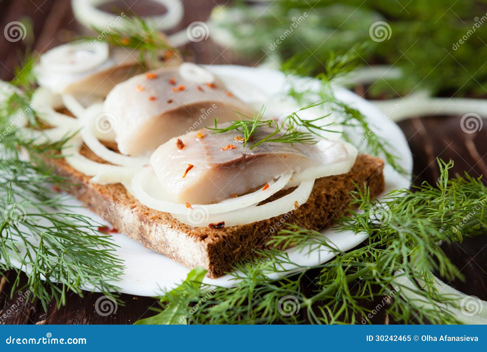 Salted Herring Fillets with Bread on a White Plate and Dill Stock Image ...