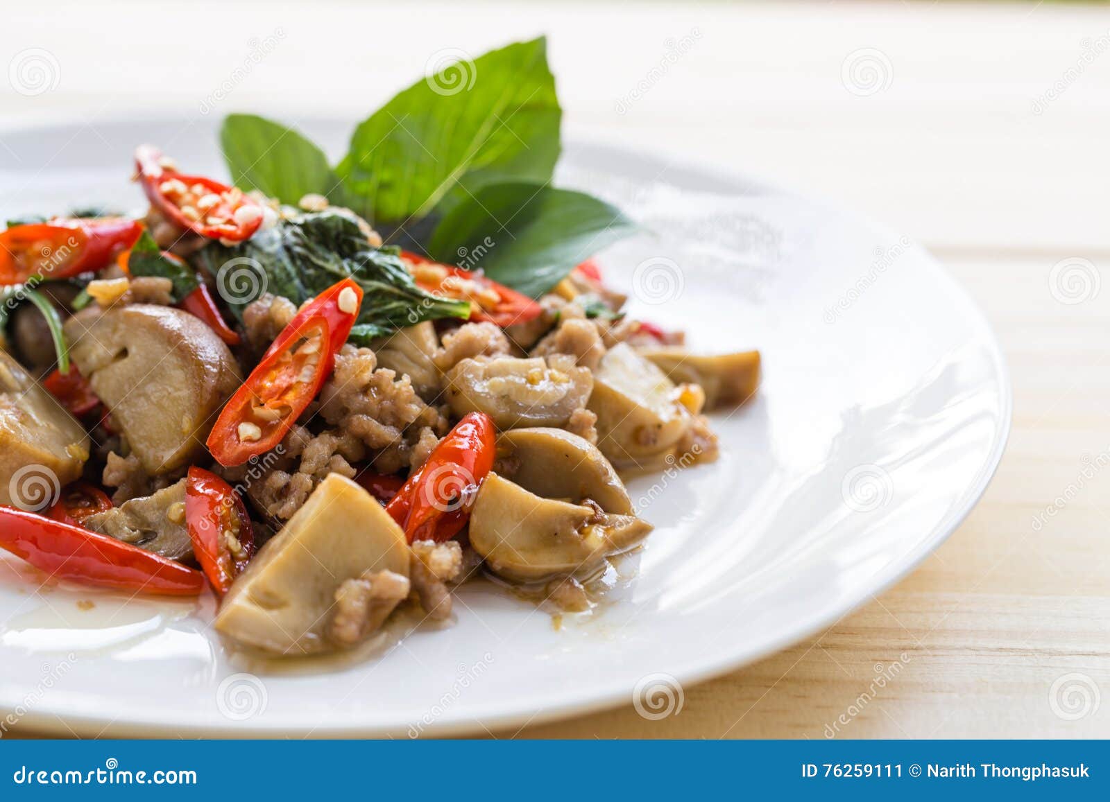 Salted Pork with Chili & Basil Leaves in Plate on Table. Stock Image ...