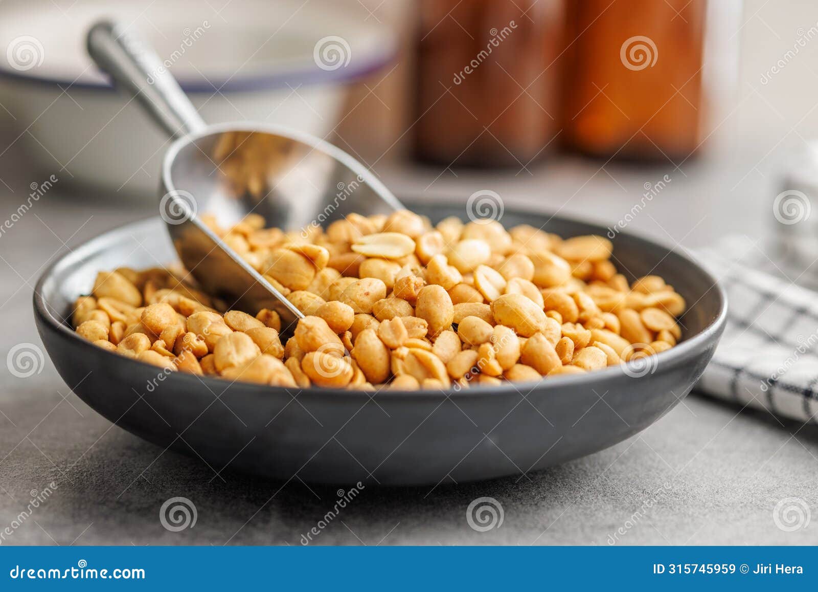 Salted Roasted Peanuts on Plate on Kitchen Table Stock Image - Image of ...