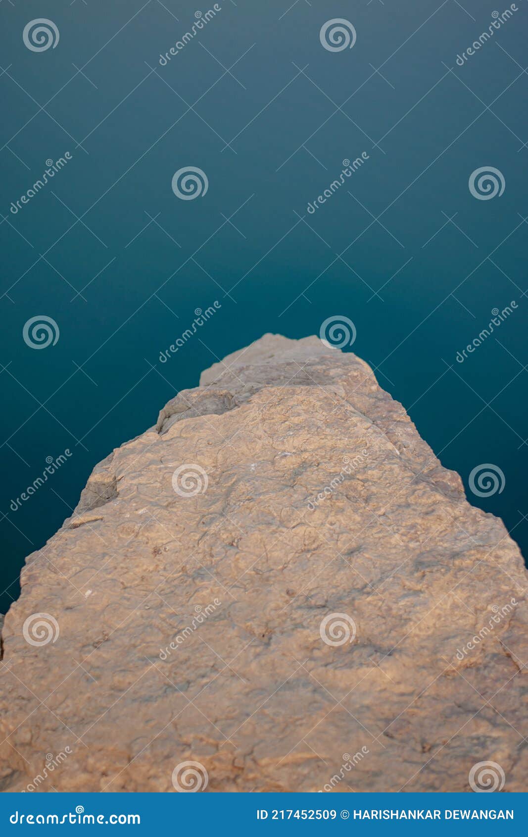 Salty rock with blue ocean stock image. Image of blue - 217452509