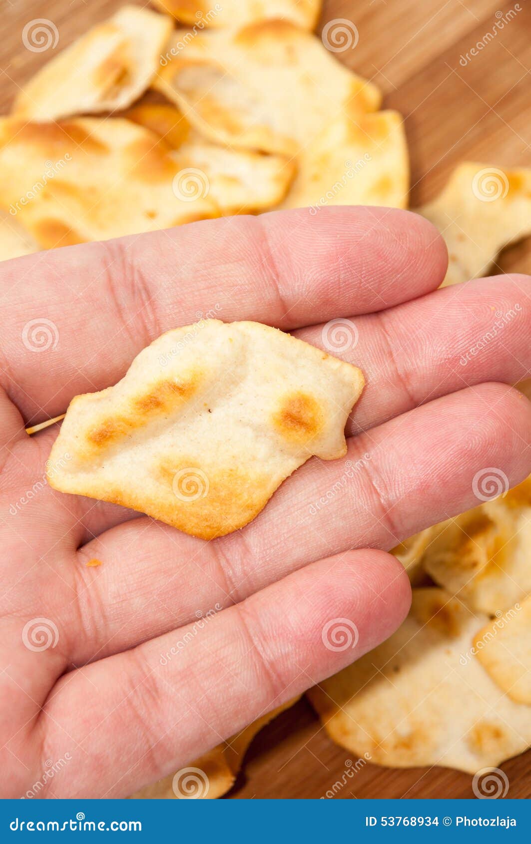 Salty snacks in hand stock photo. Image of hand, wheat - 53768934